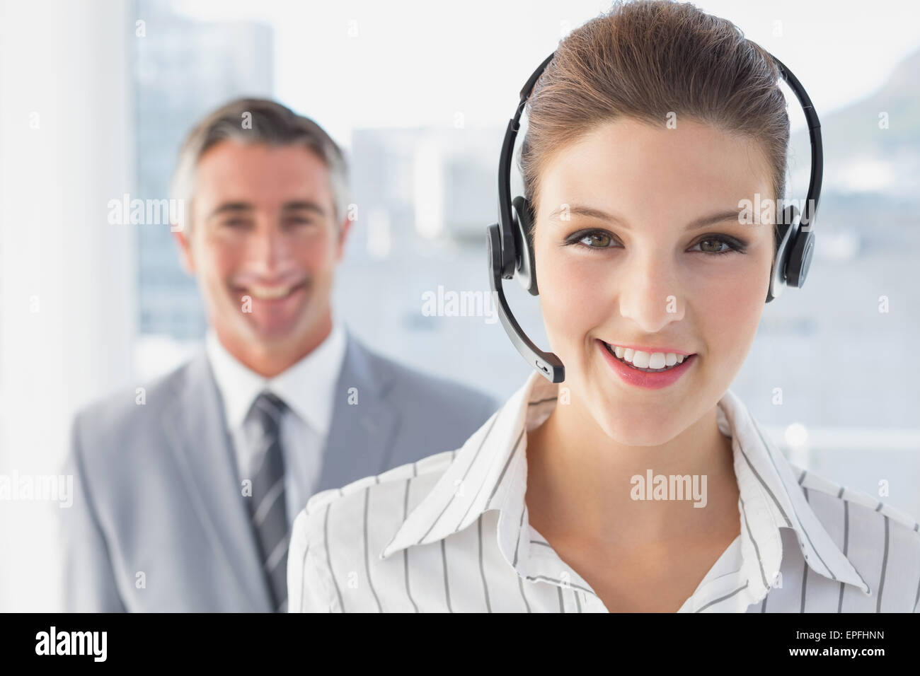 Businesswoman wearing a work headset Stock Photo - Alamy