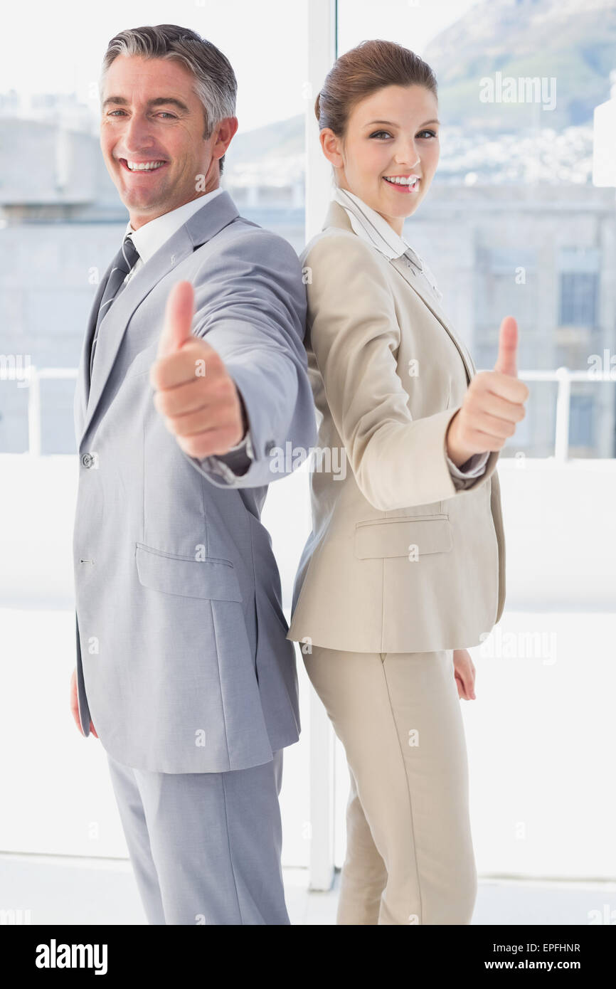 Employee's giving a thumb's up Stock Photo - Alamy