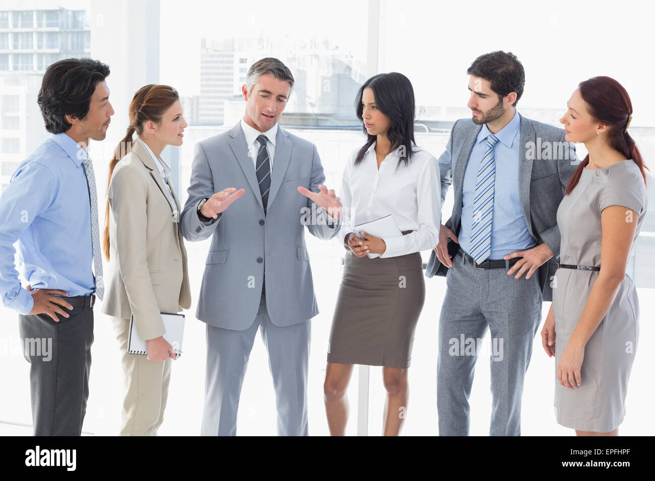 Business team chatting and smiling Stock Photo - Alamy