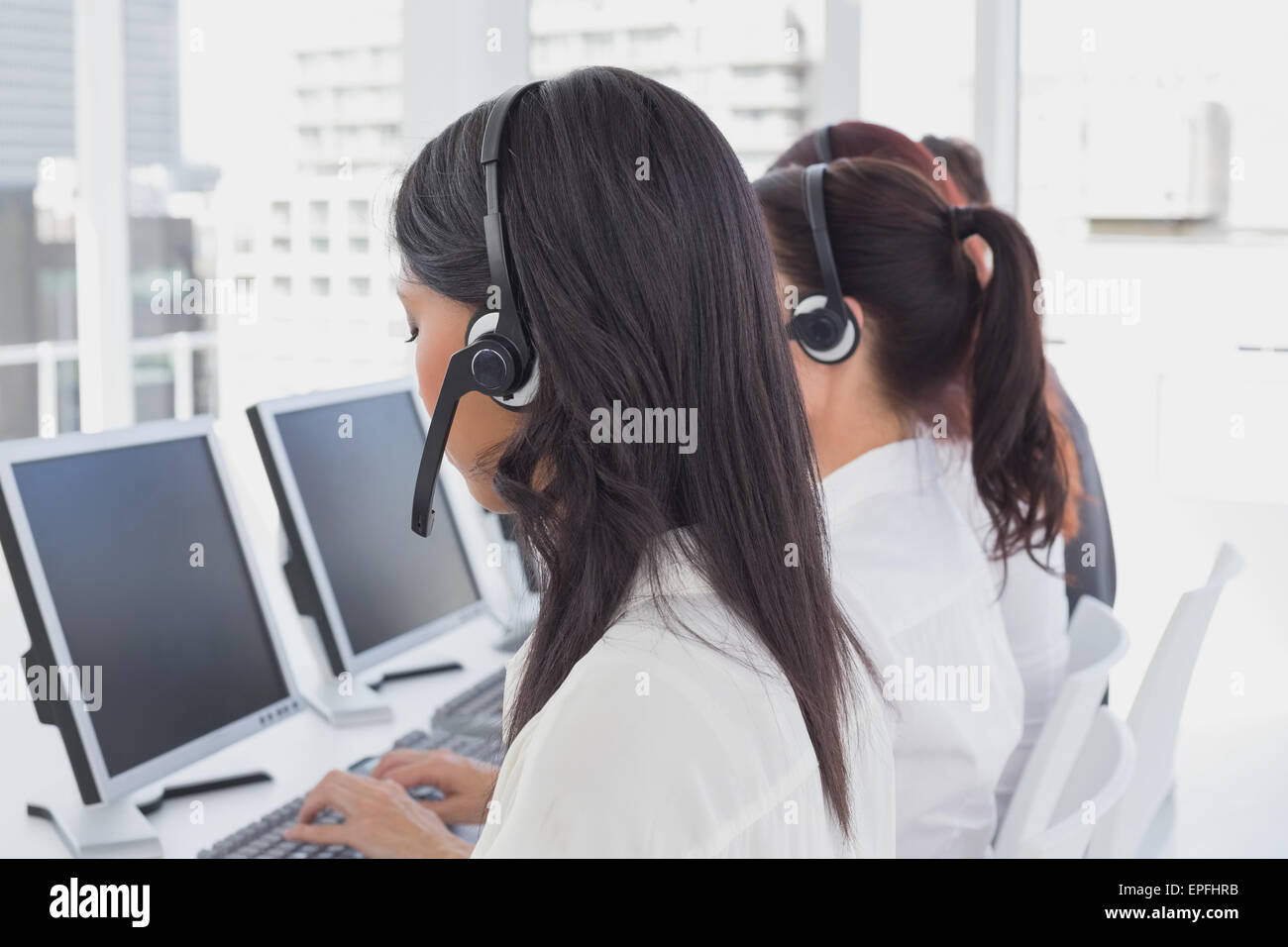 Employee's typing on their computers Stock Photo - Alamy