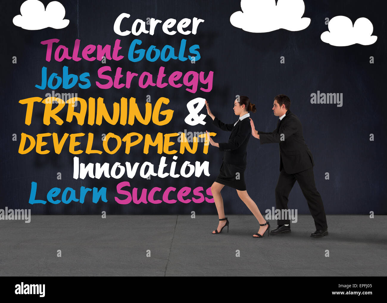 Composite image of business team standing and pushing Stock Photo - Alamy