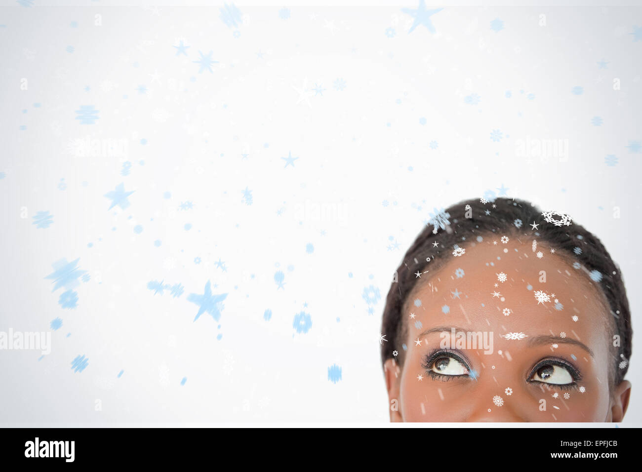 Close up of woman looking upwards diagonally on white background Stock ...