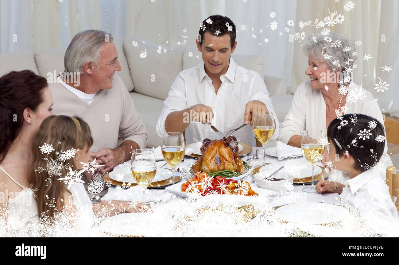 Composite image of father serving turkey to his family in a dinner ...
