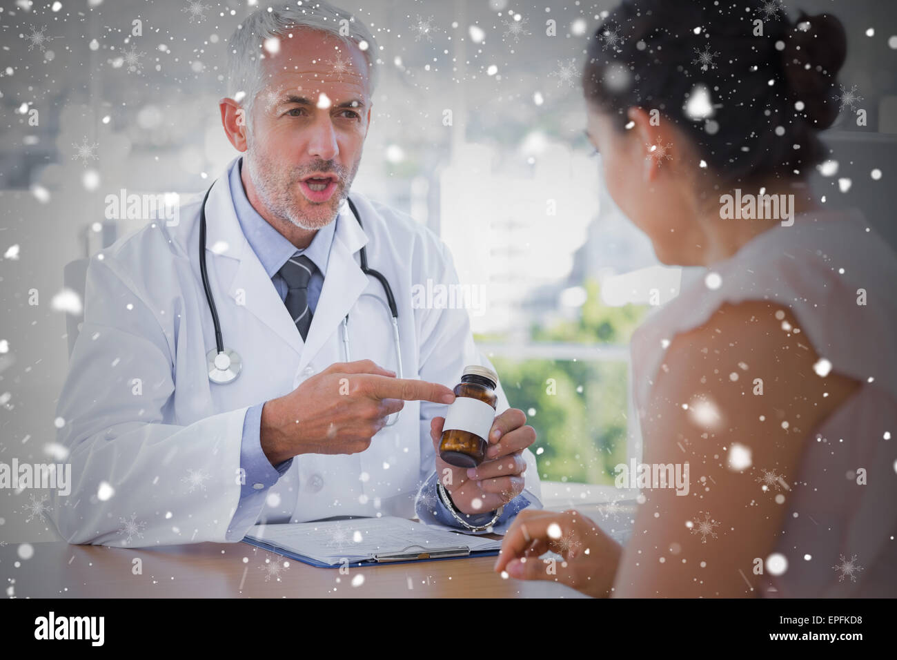 Composite image of doctor explaining the pills to patient Stock Photo ...