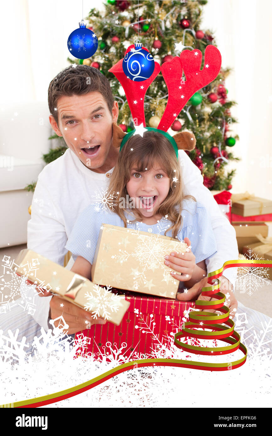 Surprised father and his girl opening christmas gifts Stock Photo - Alamy