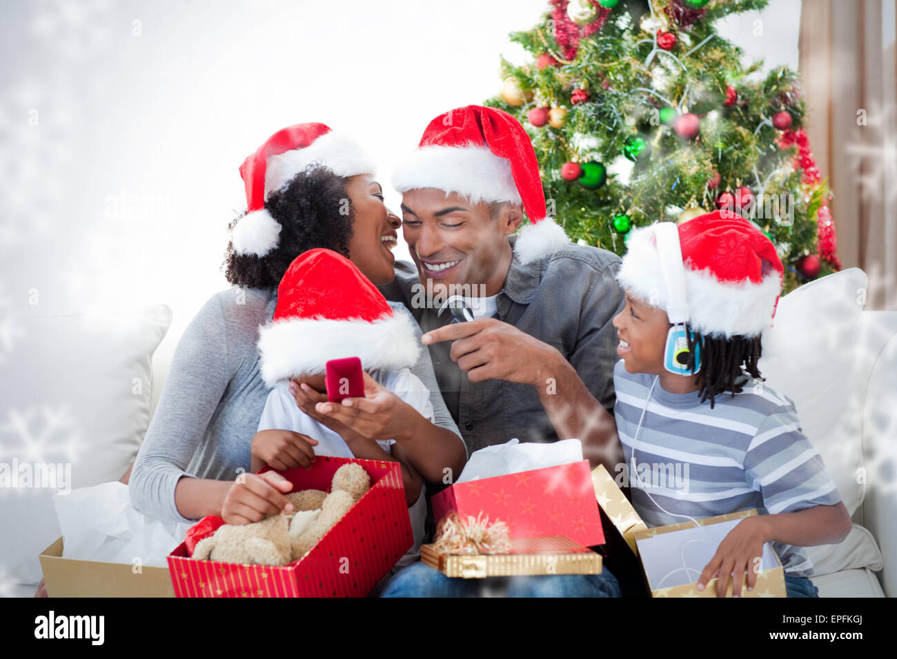 Happy family having fun with christmas presents Stock Photo - Alamy