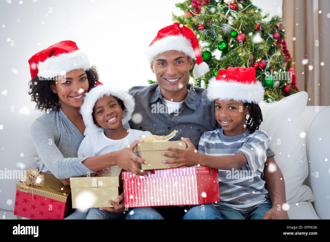 Smiling family sharing christmas presents Stock Photo - Alamy