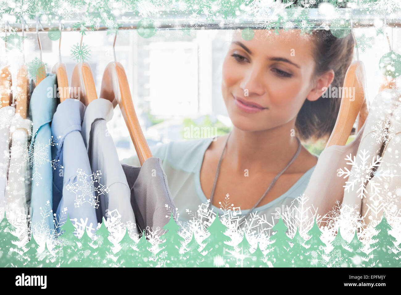 Attractive fashion woman looking at clothes Stock Photo - Alamy