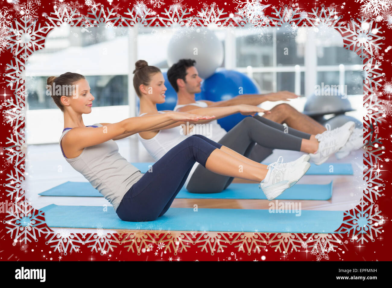 Class stretching on mats at yoga class Stock Photo - Alamy