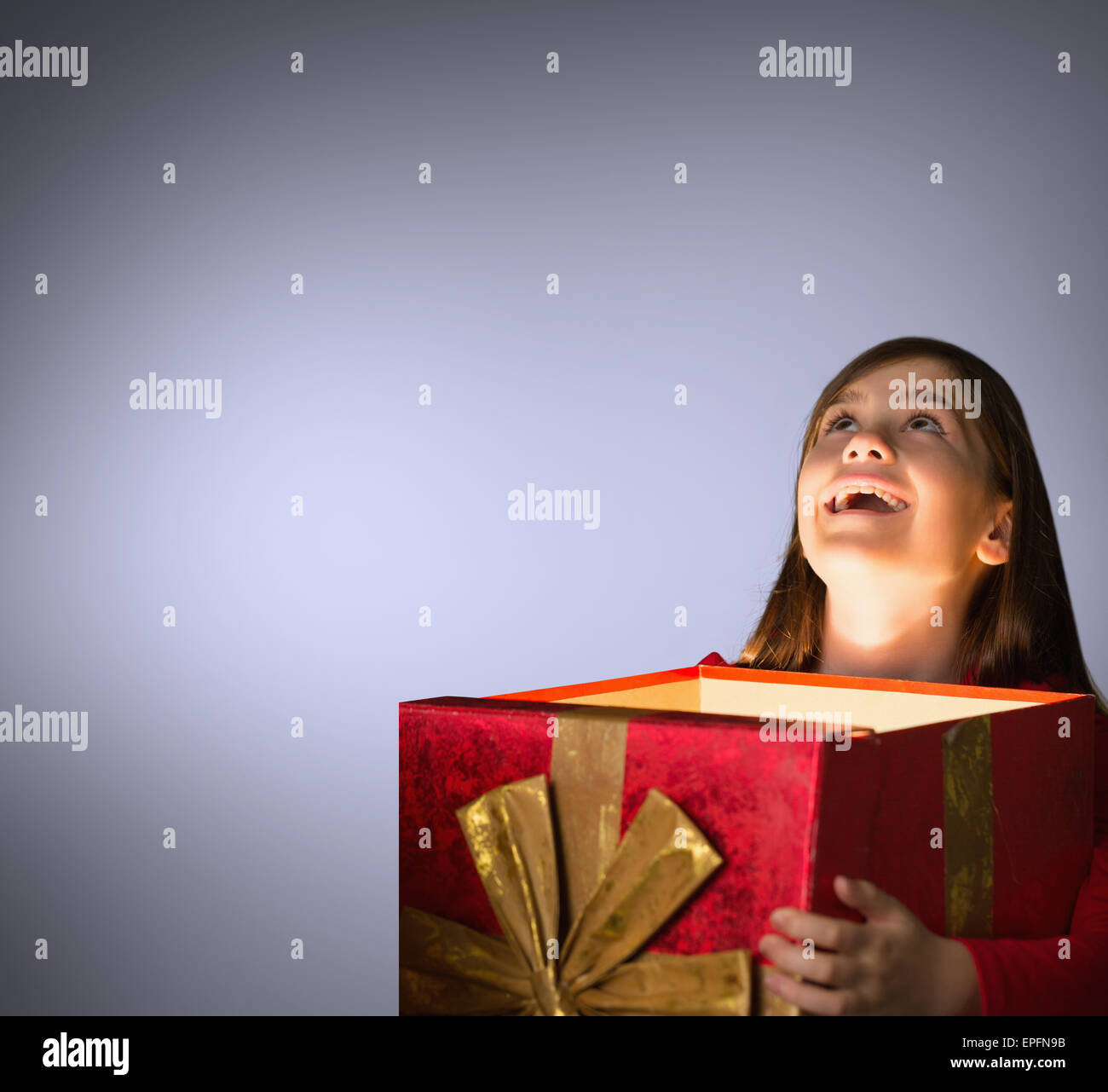 Happy girl opening gift hi-res stock photography and images - Alamy