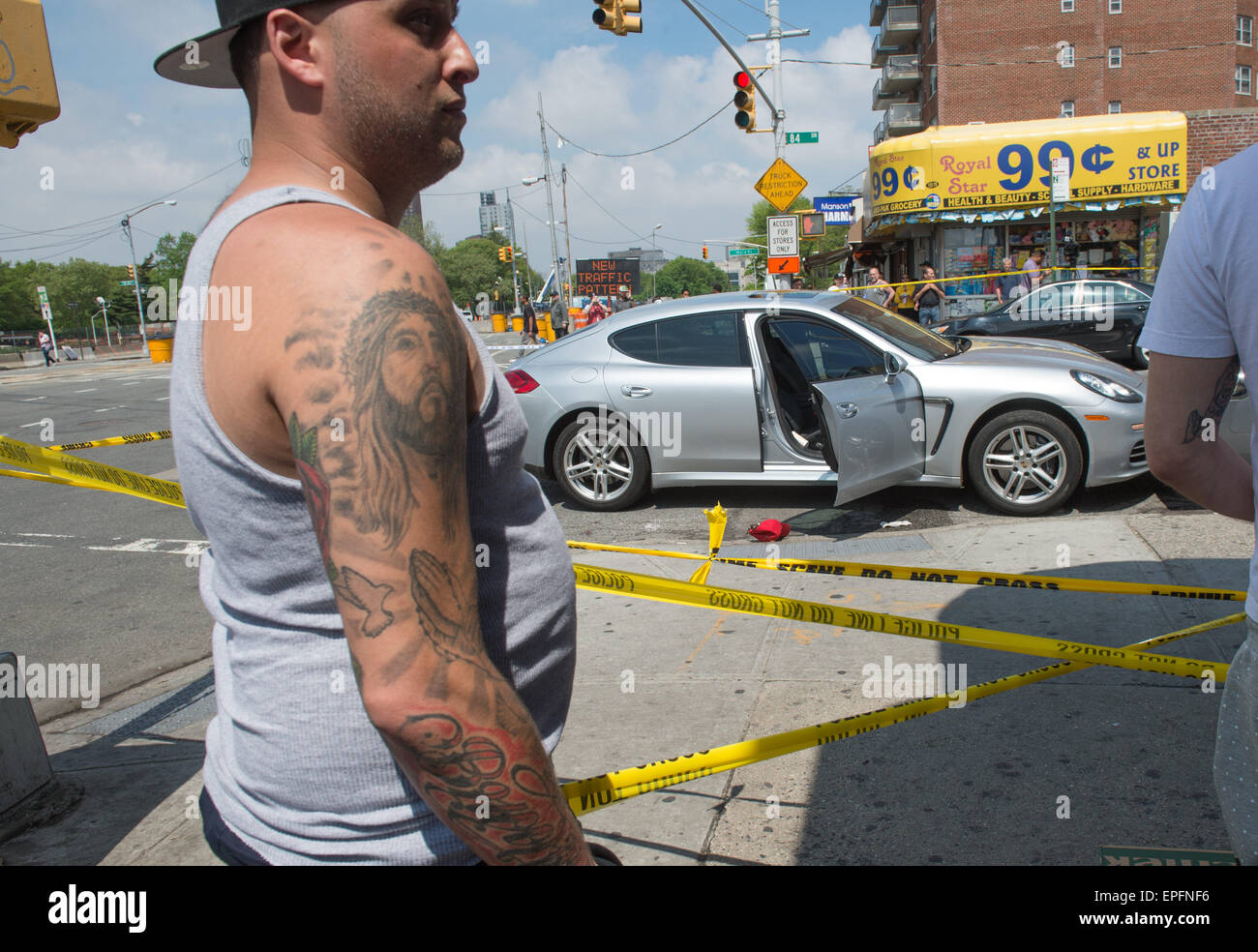 Queens, New York, USA. 17th May, 2015. People gather at the scene where ...