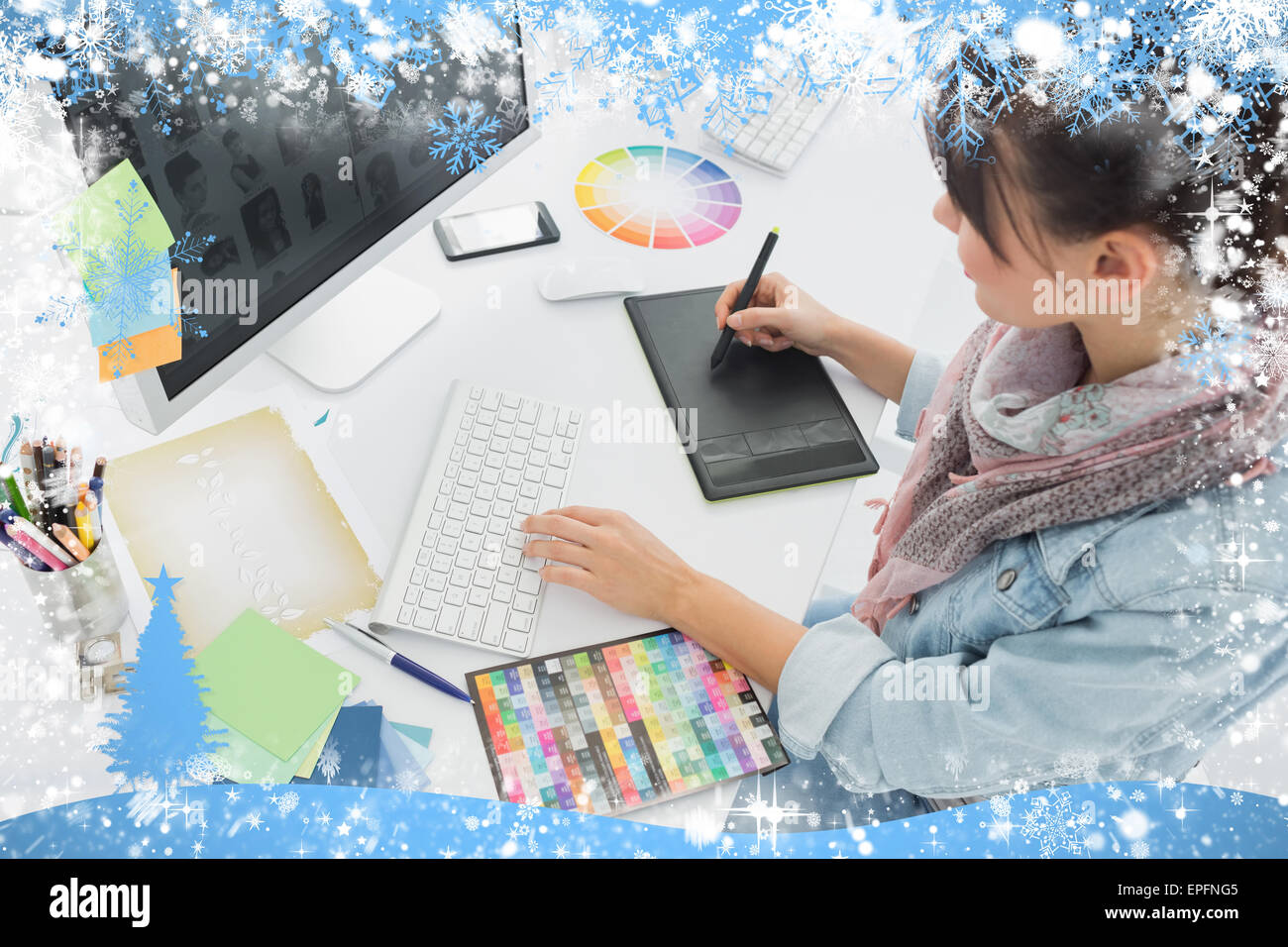 Artist drawing something on graphic tablet at office Stock Photo - Alamy