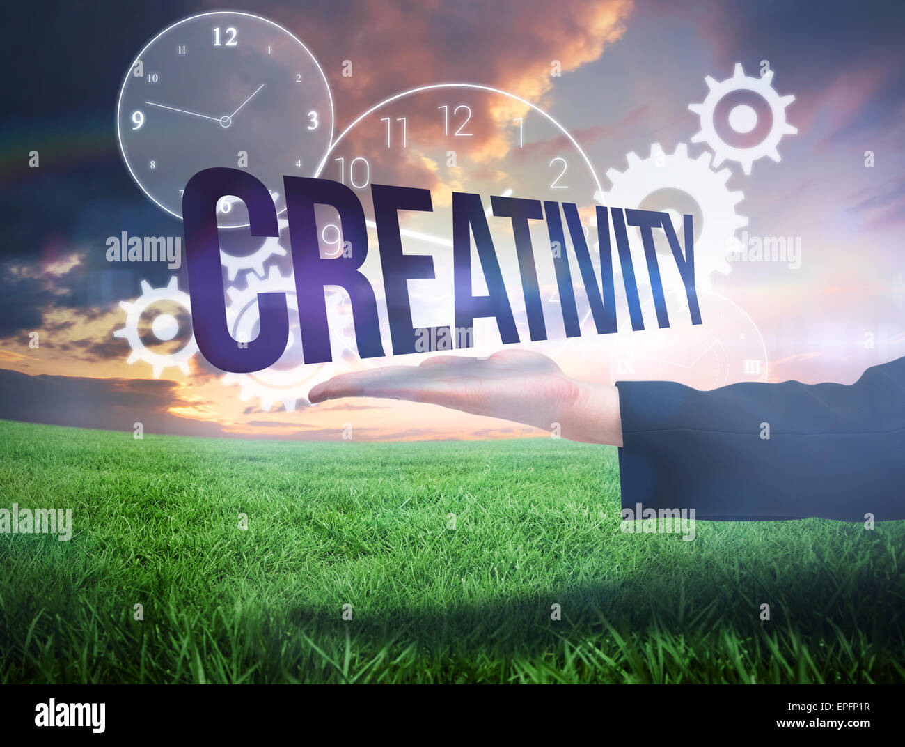 Businesswomans hand presenting the word creativity Stock Photo - Alamy