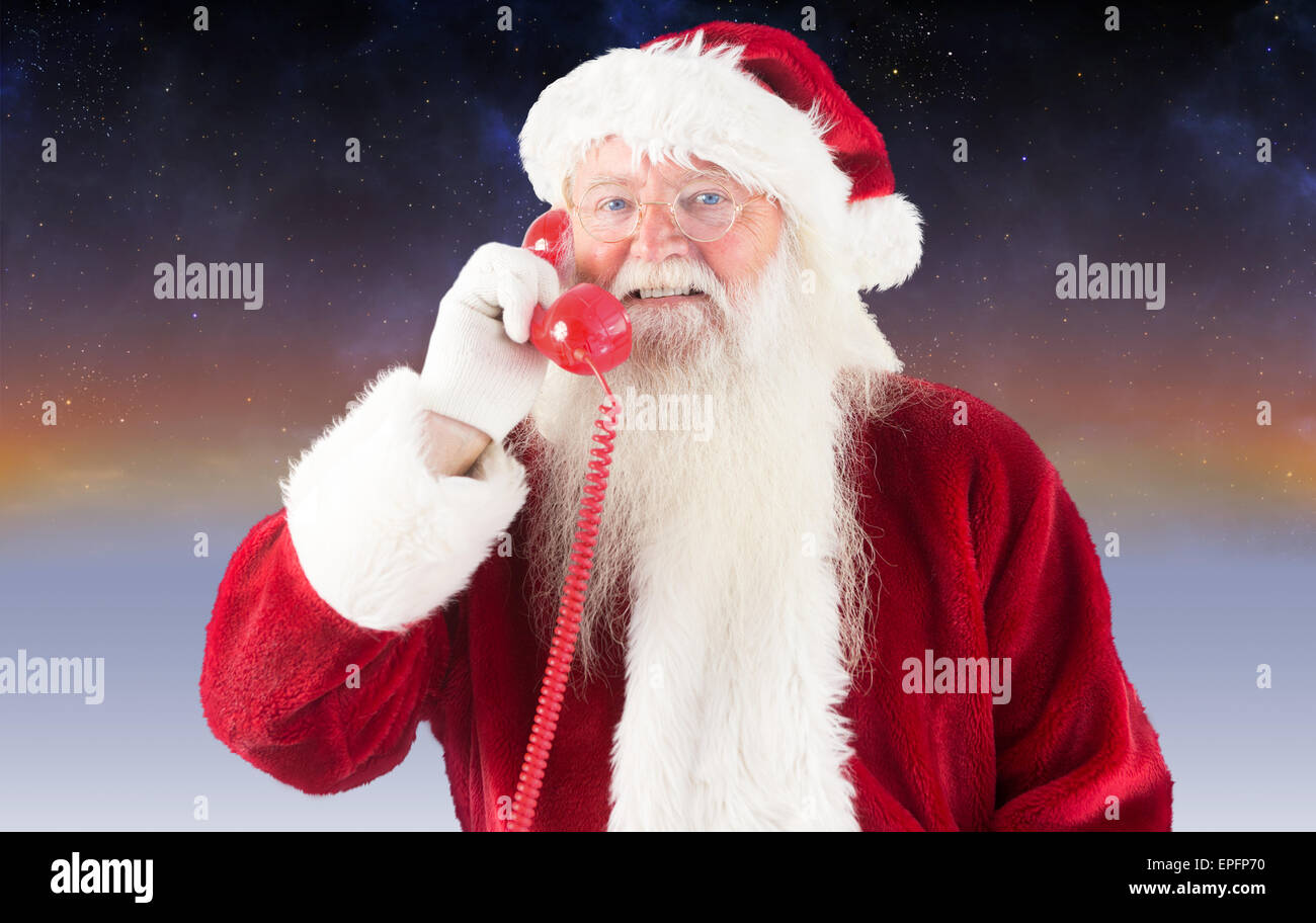 Composite image of santa claus on the phone Stock Photo - Alamy