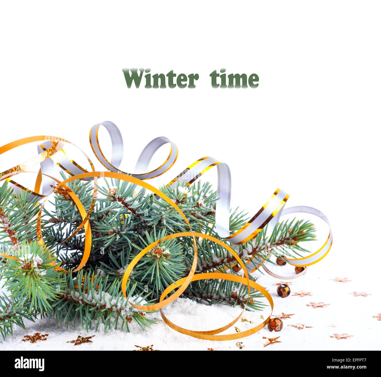 Christmas fir branch with gold streamers and stars on a white ...