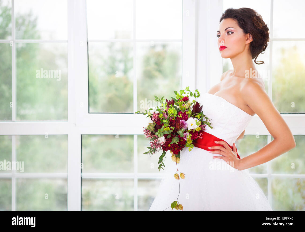 Bride holding unusual wedding bouquet Stock Photo - Alamy