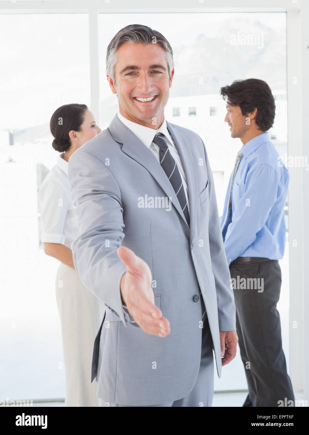 Businessman offering shake hands hi-res stock photography and images ...