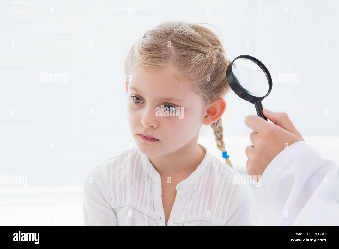 Practitioner doctor magnifying glass hi-res stock photography and images - Alamy