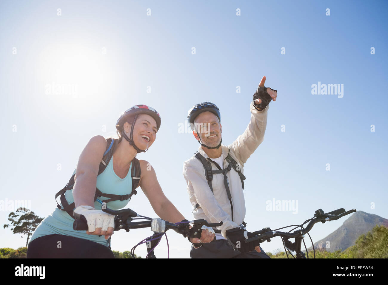 Active couple going for a bike ride in the countryside Stock Photo - Alamy