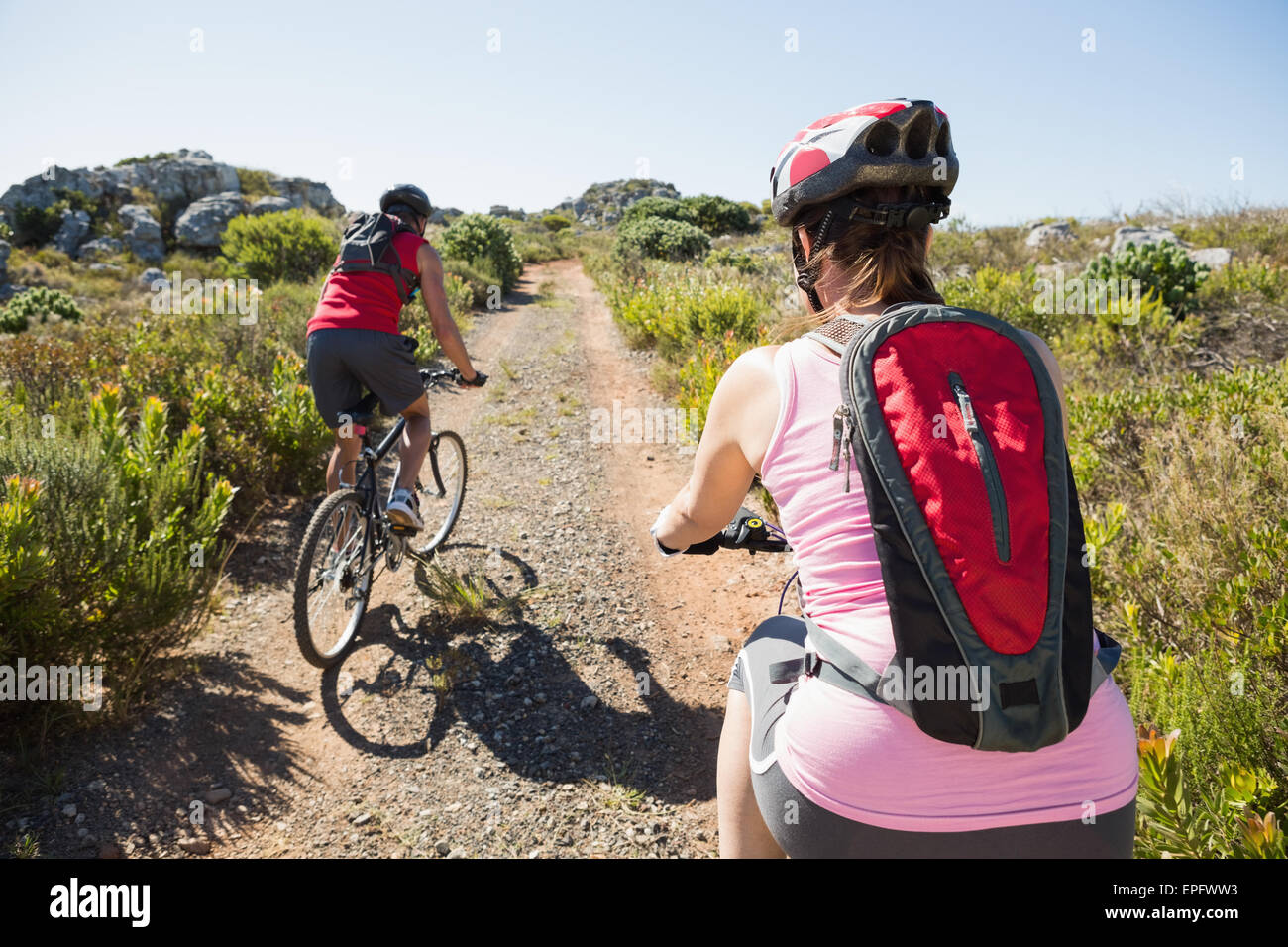Active couple on a bike ride in the countryside Stock Photo - Alamy