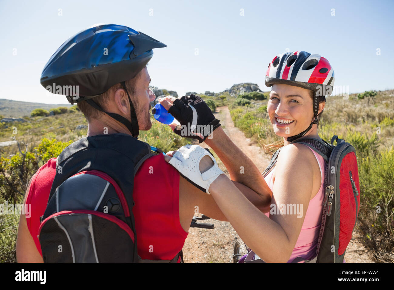 Active couple on a bike ride in the countryside Stock Photo - Alamy