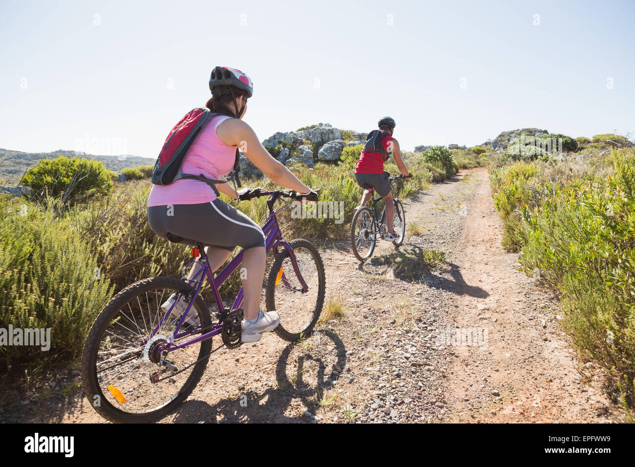 Active couple on a bike ride in the countryside Stock Photo - Alamy