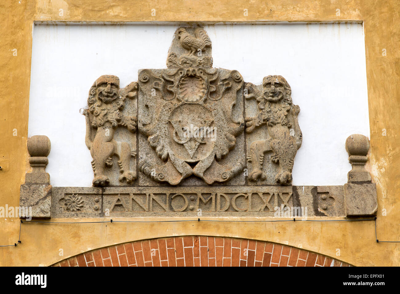 Stone heraldic shield above entrance to the fort area of historic town ...