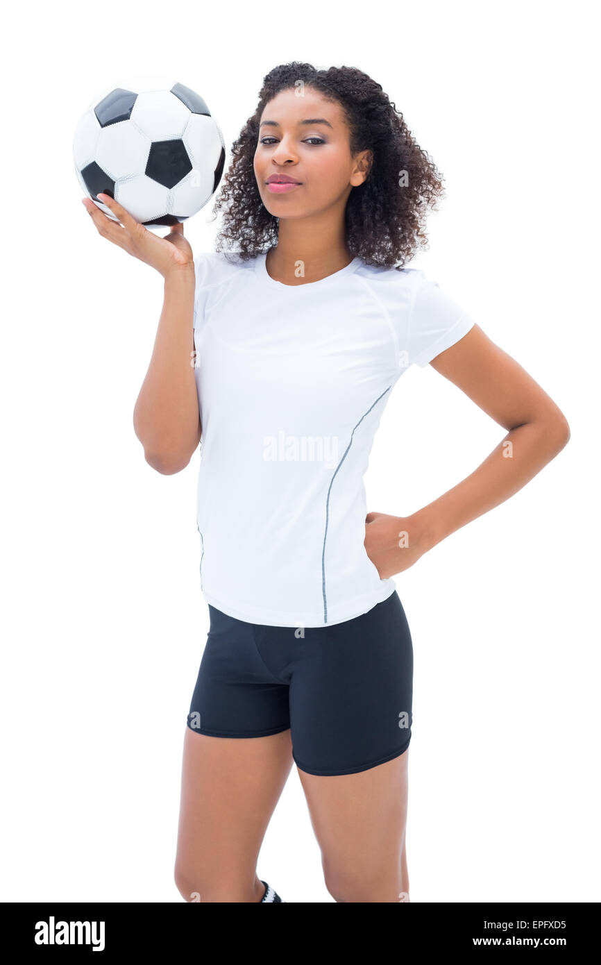 Pretty football fan in white holding ball Stock Photo - Alamy