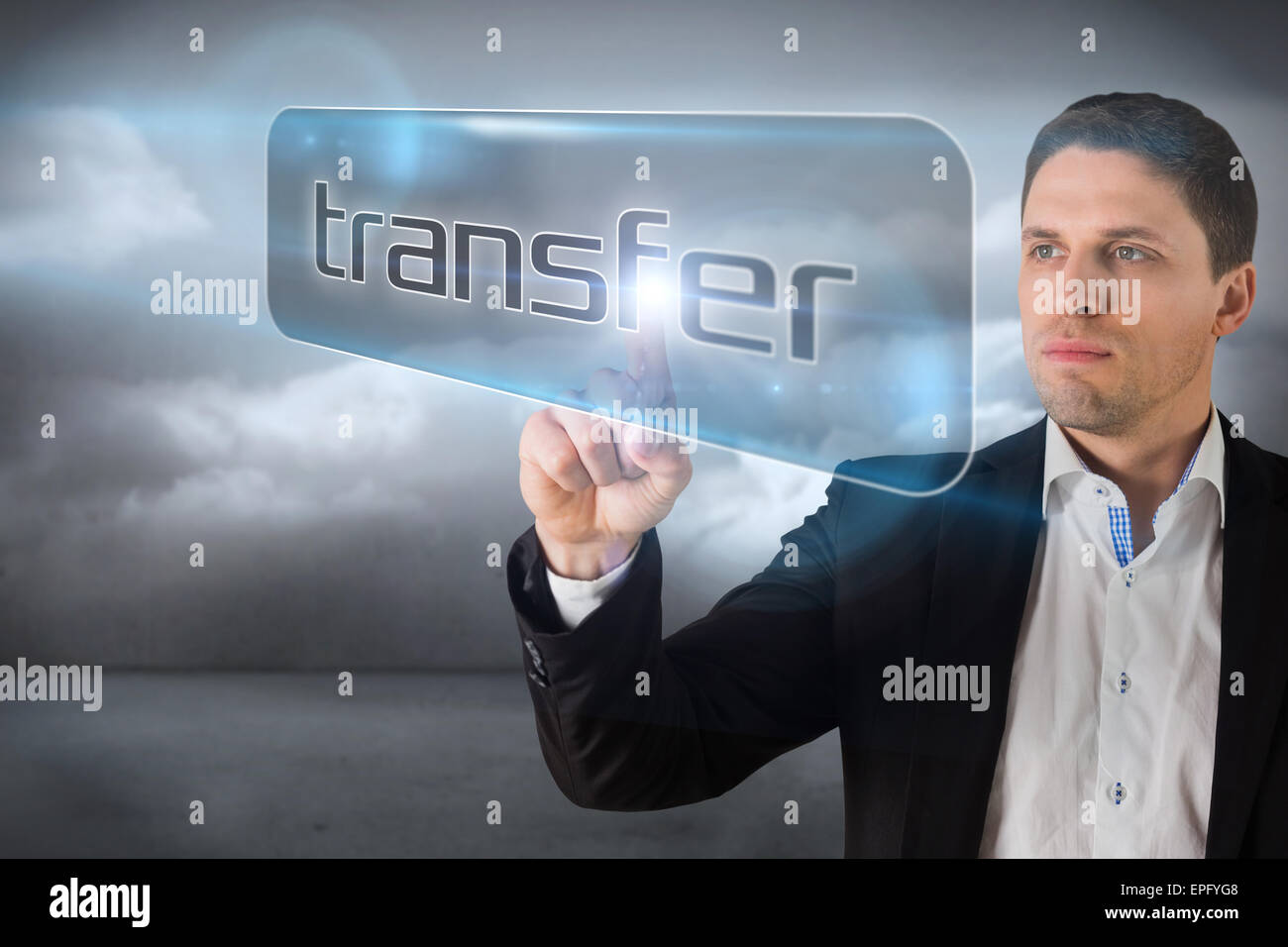 Businessman pointing to word transfer Stock Photo - Alamy