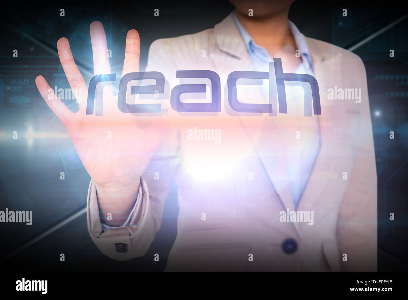 Businesswoman presenting the word reach Stock Photo - Alamy