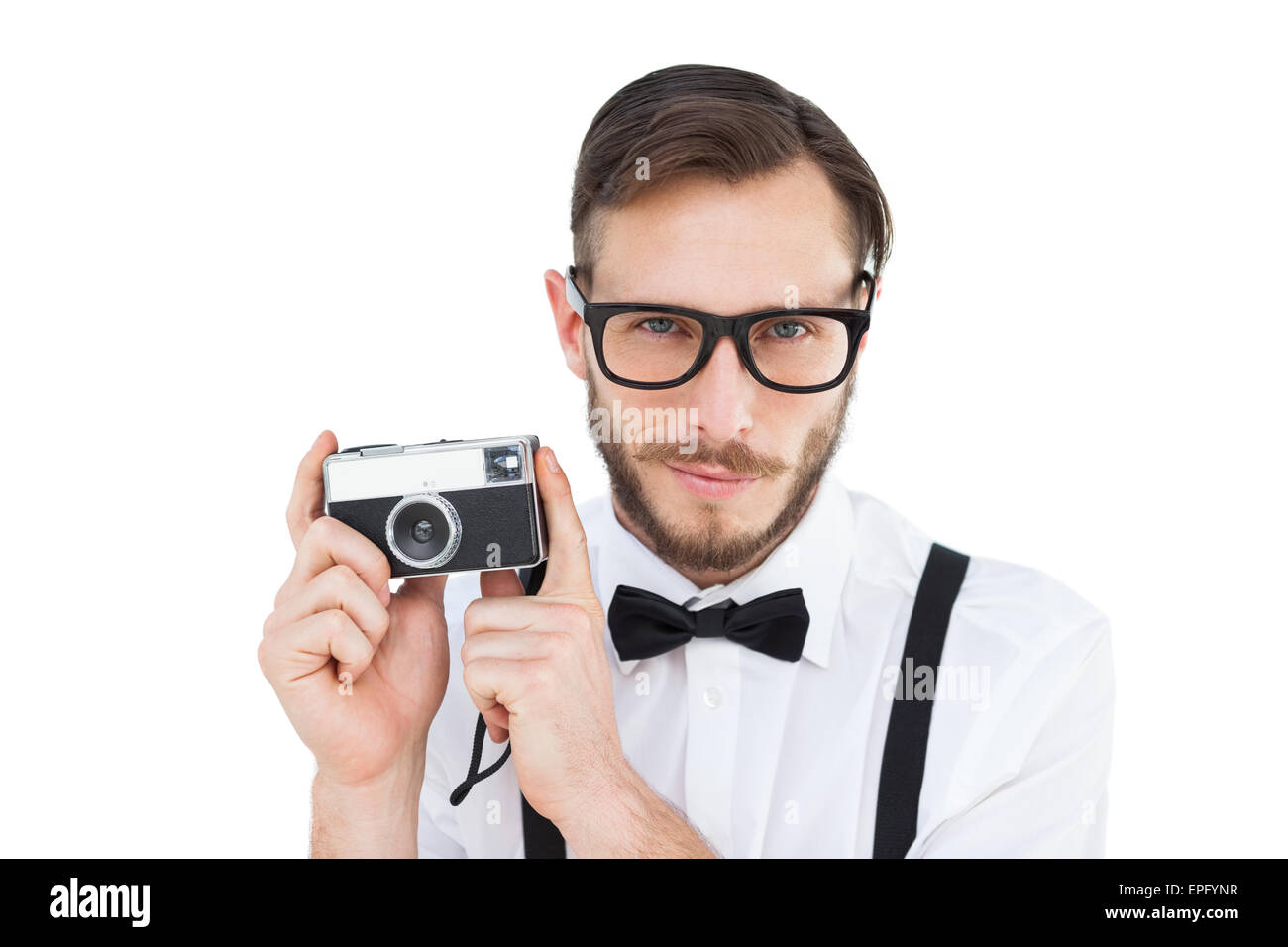 Geeky hipster holding a retro camera Stock Photo - Alamy