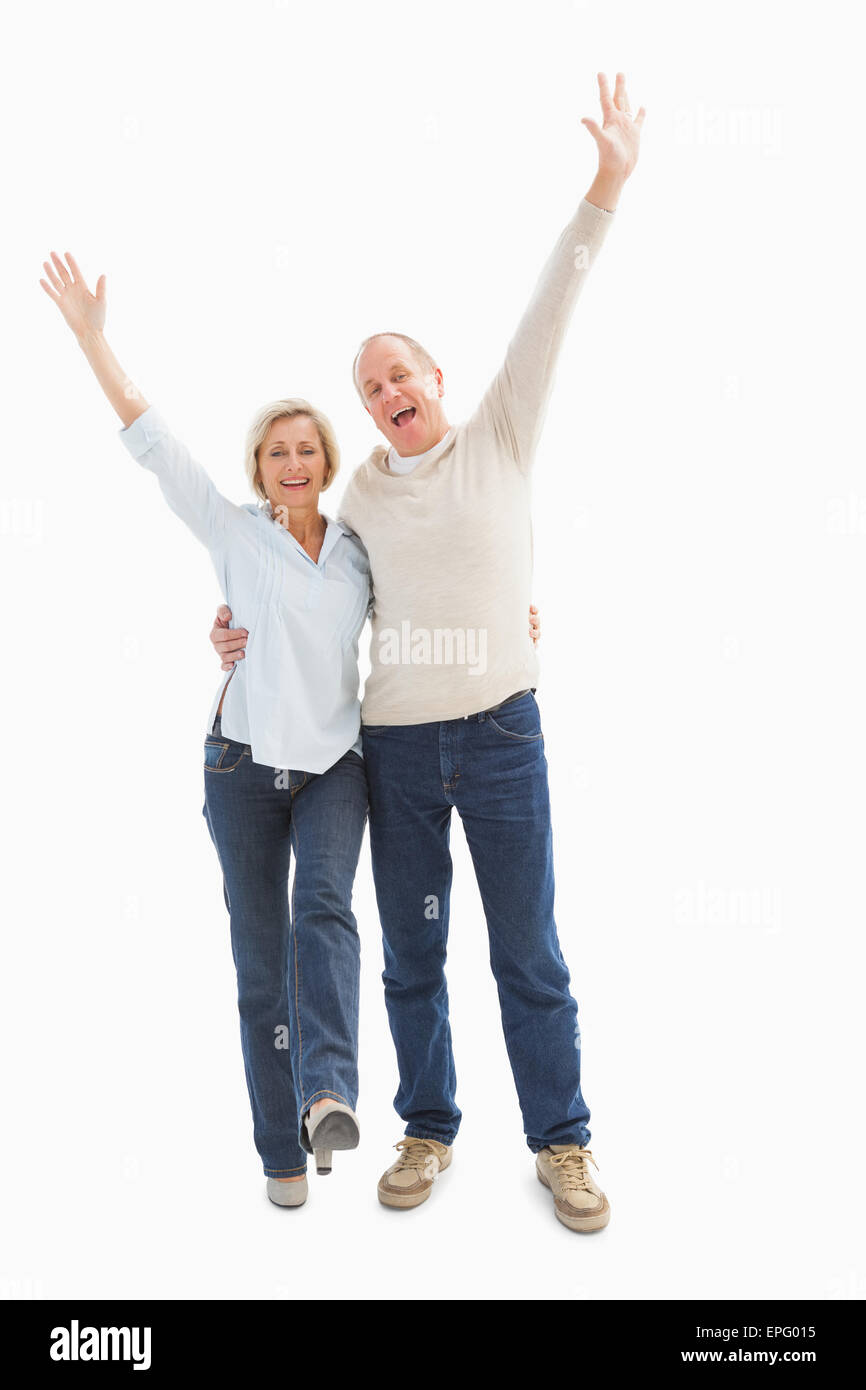 Happy mature couple cheering at camera Stock Photo - Alamy