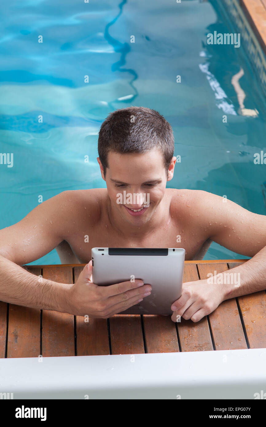 Man in the edge of the pool Stock Photo - Alamy