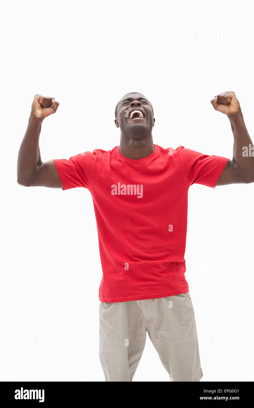 Football fan in red cheering Stock Photo - Alamy