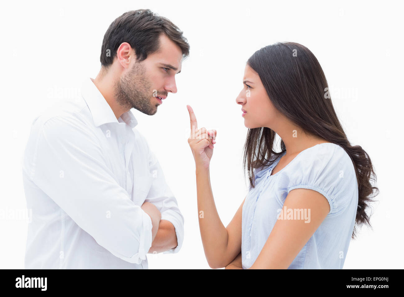 Angry couple facing off during argument Stock Photo - Alamy