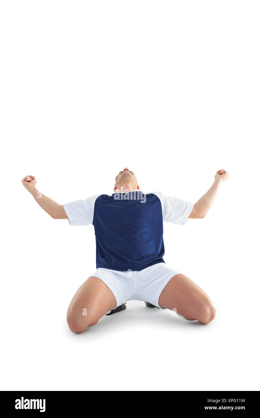 Football player in blue celebrating Stock Photo - Alamy