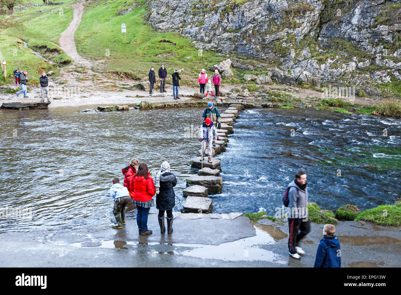Tourists walking over the stepping stones at Dovedale on the ...
