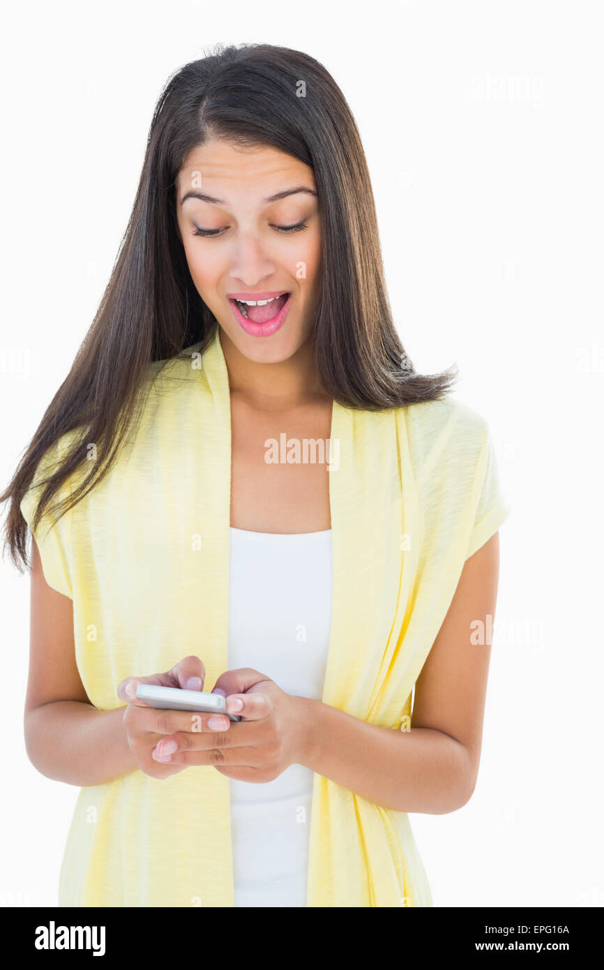 Shocked casual woman reading a text Stock Photo - Alamy