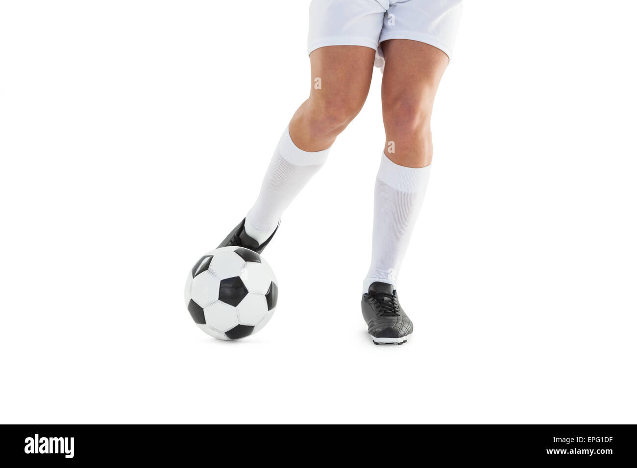 Football player kicking the ball Stock Photo - Alamy