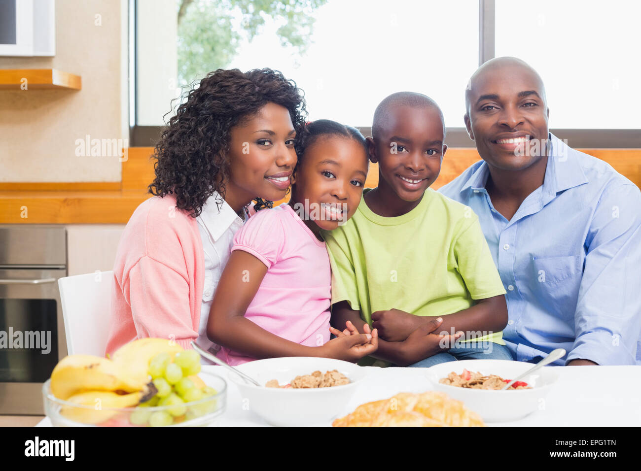 Happy family having breakfast together in the morning Stock Photo - Alamy