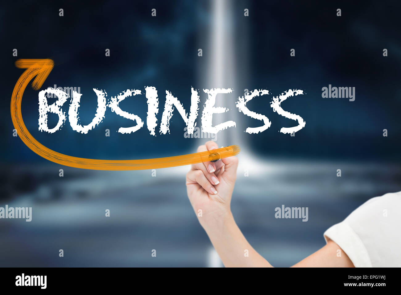 Businesswoman writing the word business Stock Photo - Alamy
