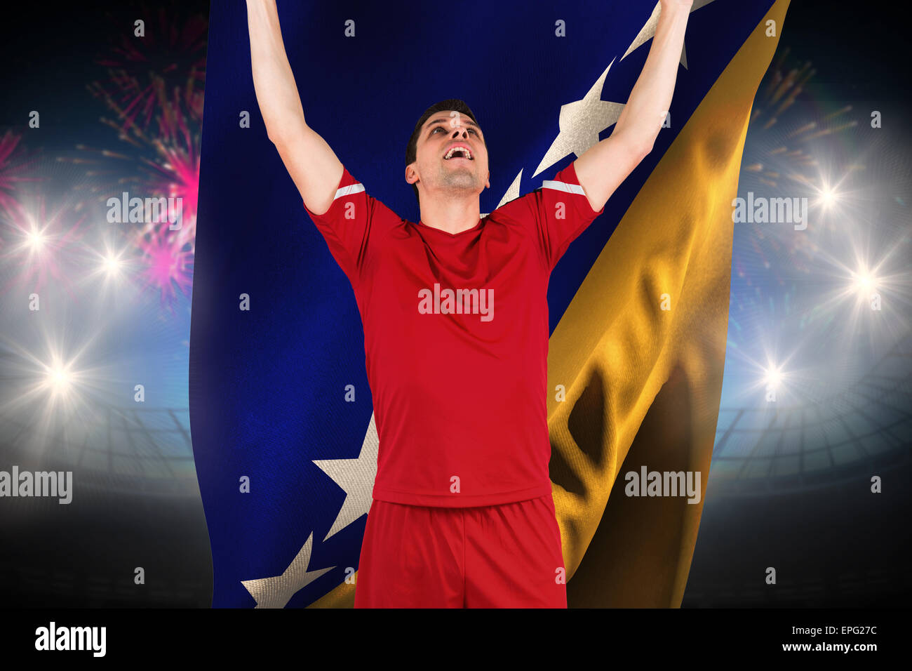 Composite image of excited football player cheering Stock Photo - Alamy