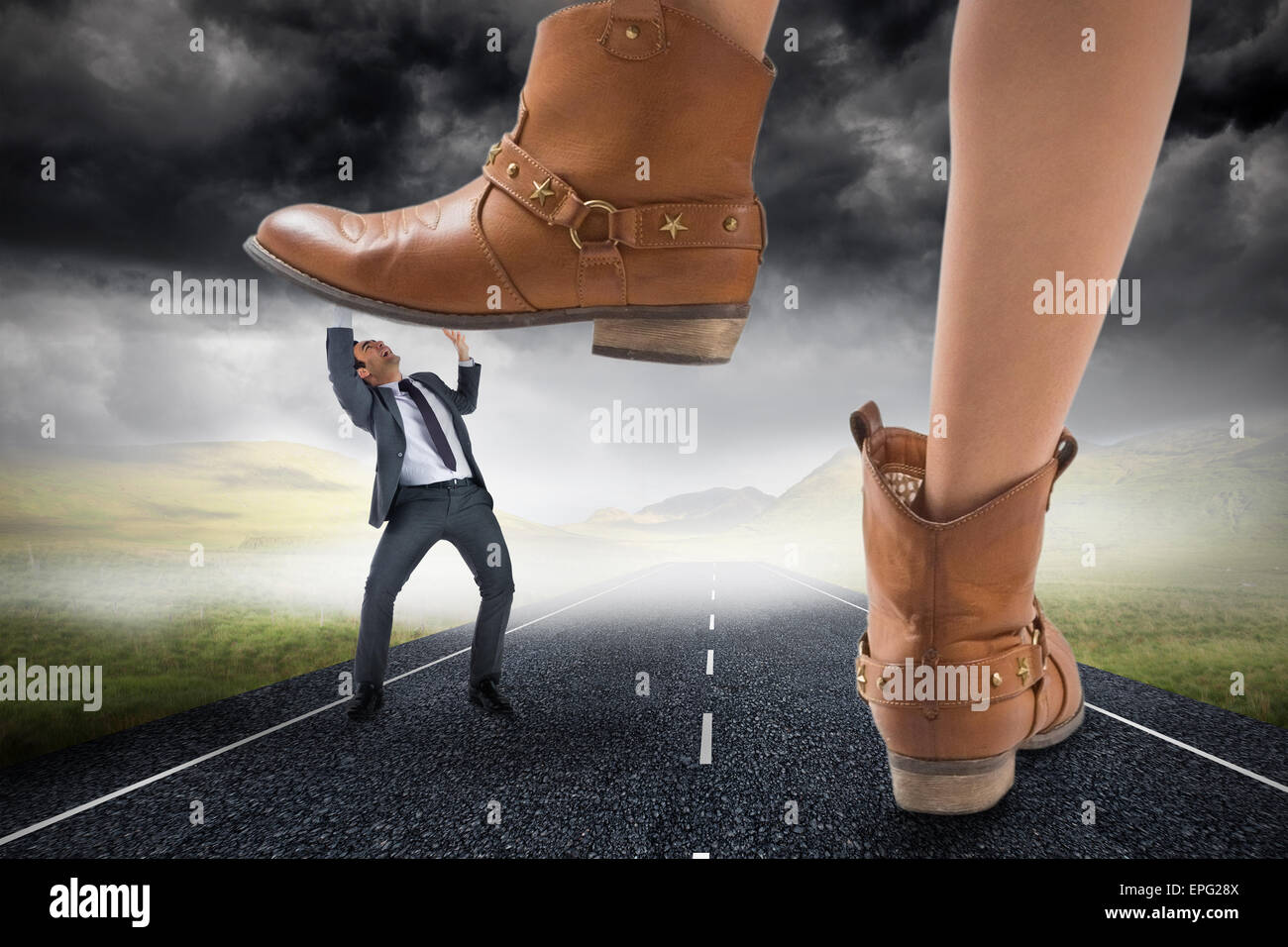 Composite image of cowboy boots stepping on businessman Stock Photo - Alamy