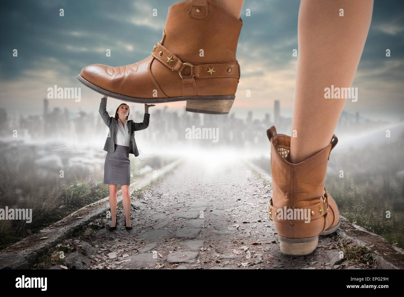 Composite image of cowboy boots stepping on businesswoman Stock Photo ...