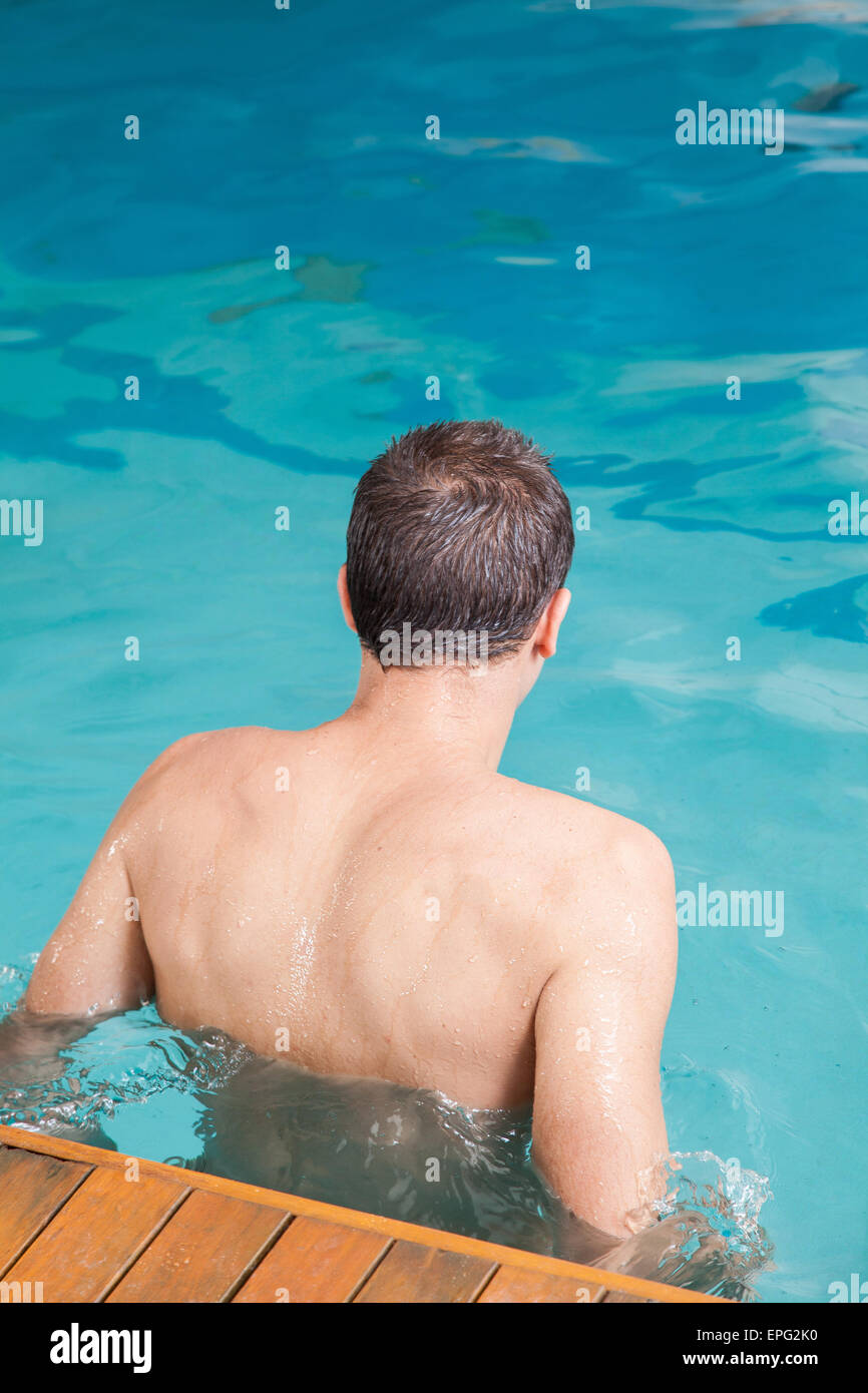 Man in the pool Stock Photo - Alamy