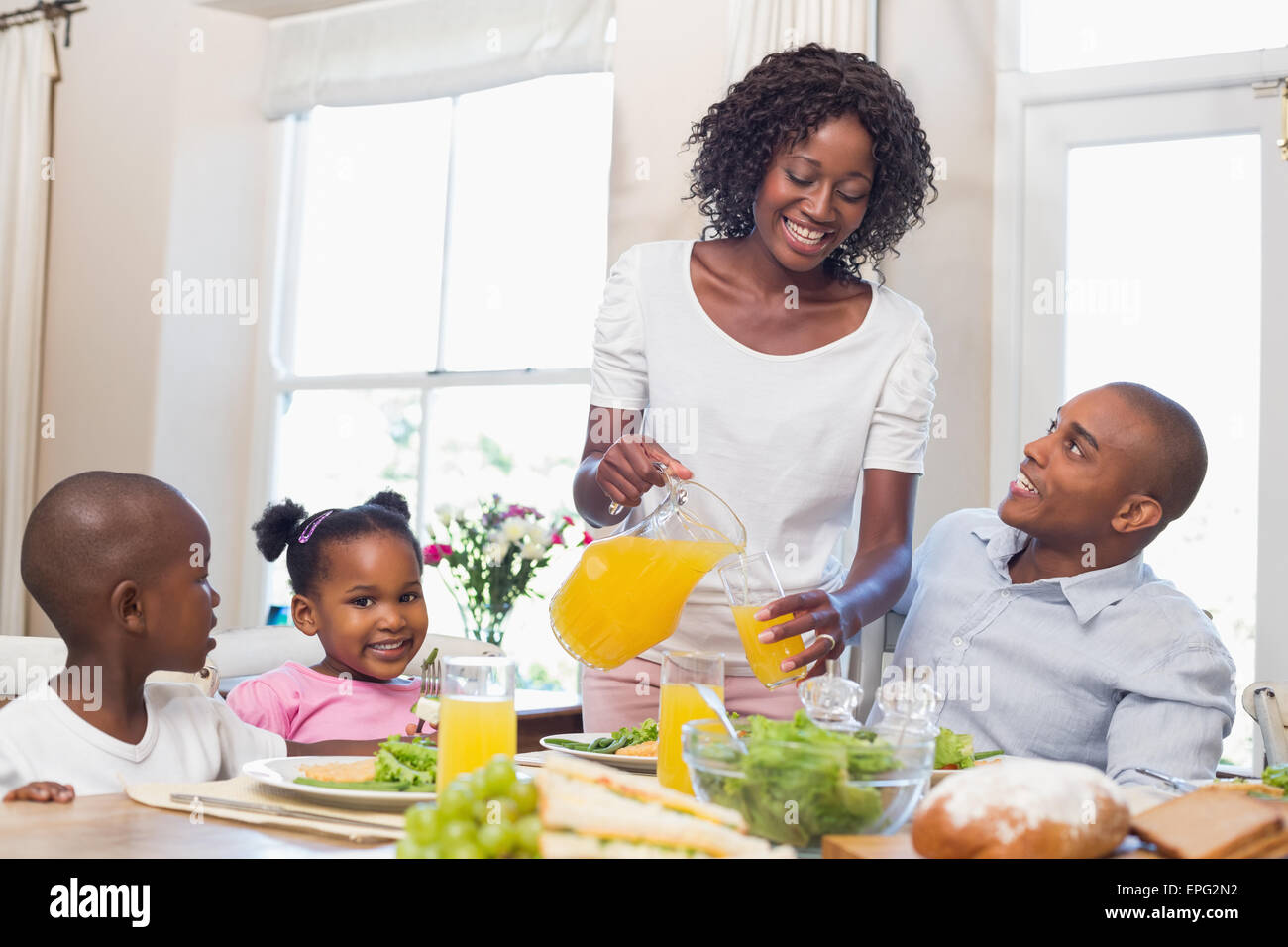 Happy family enjoying a healthy meal together Stock Photo - Alamy