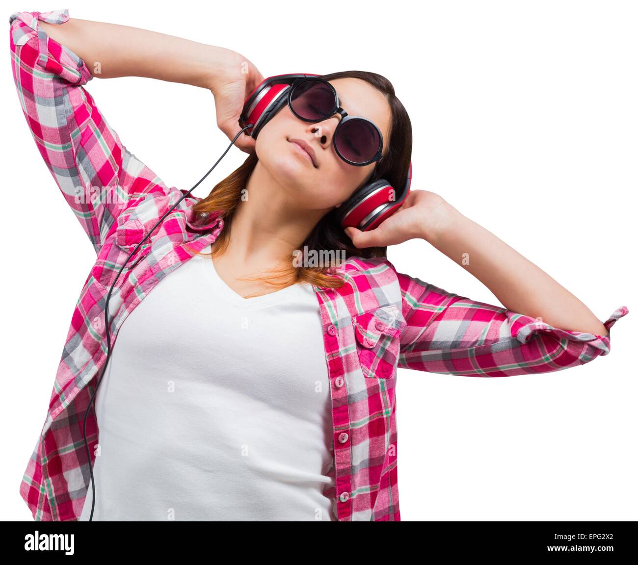 Casual brunette listening to music Stock Photo - Alamy
