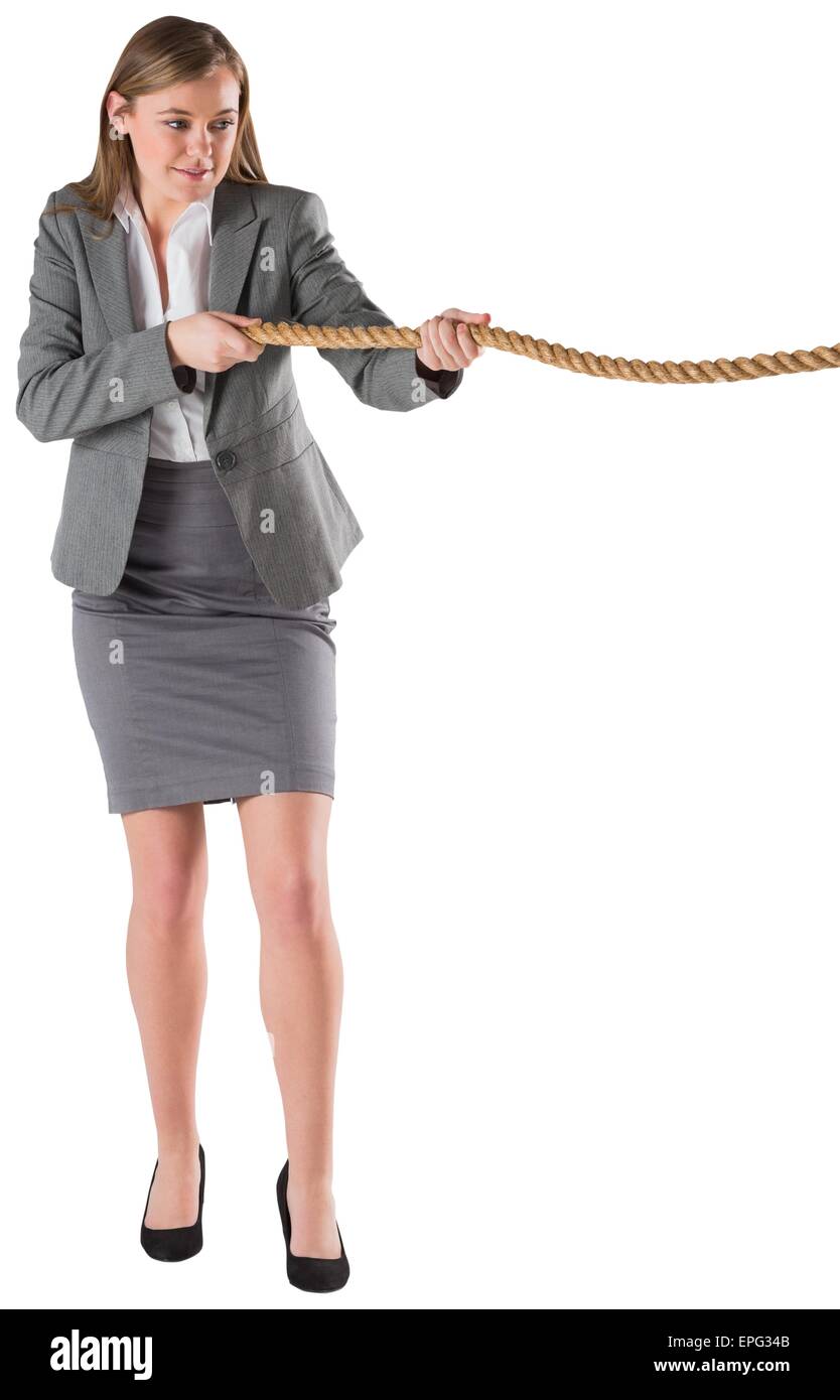 Businesswoman pulling a rope Stock Photo - Alamy