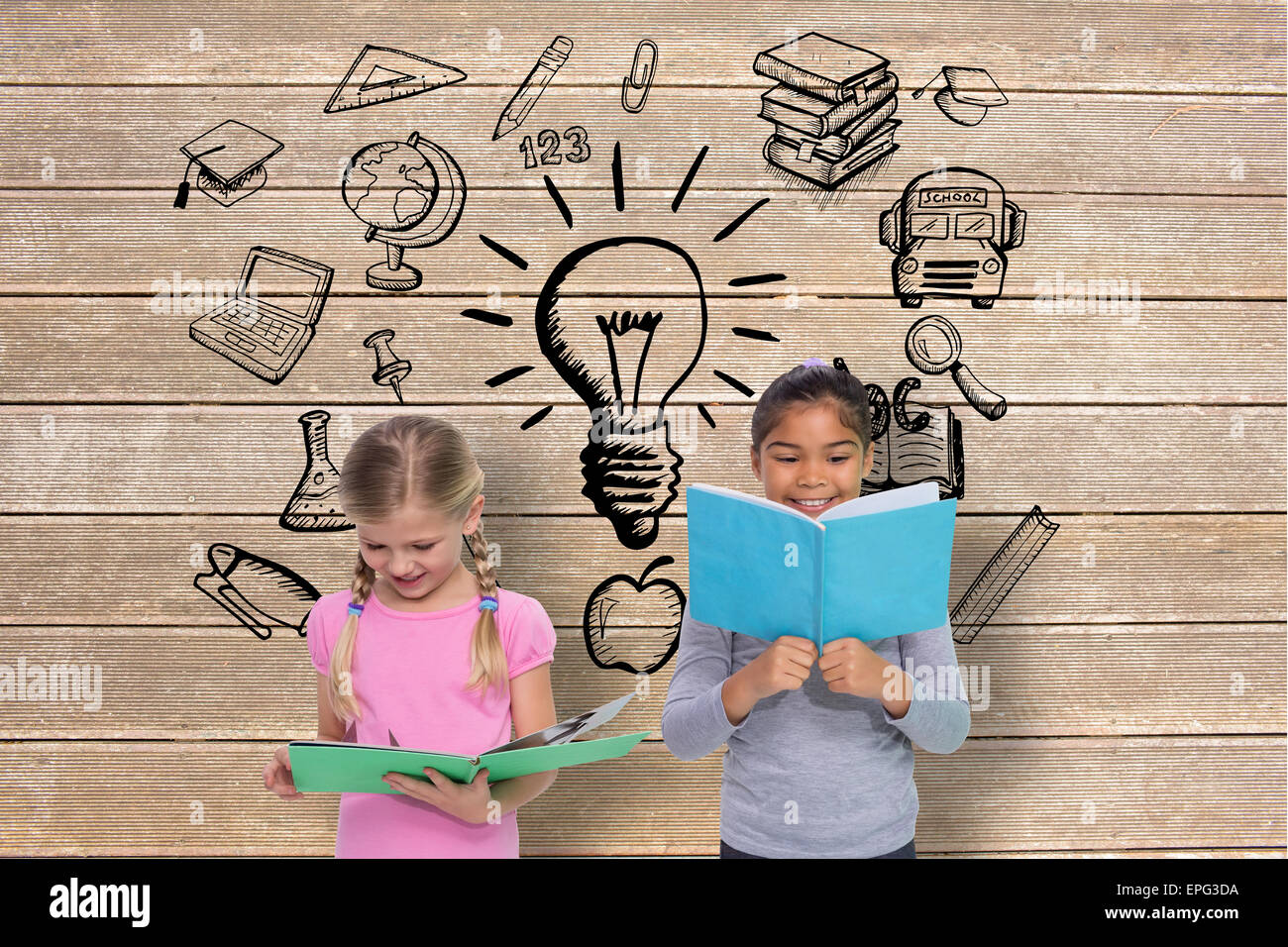 Composite image of elementary pupils reading Stock Photo - Alamy