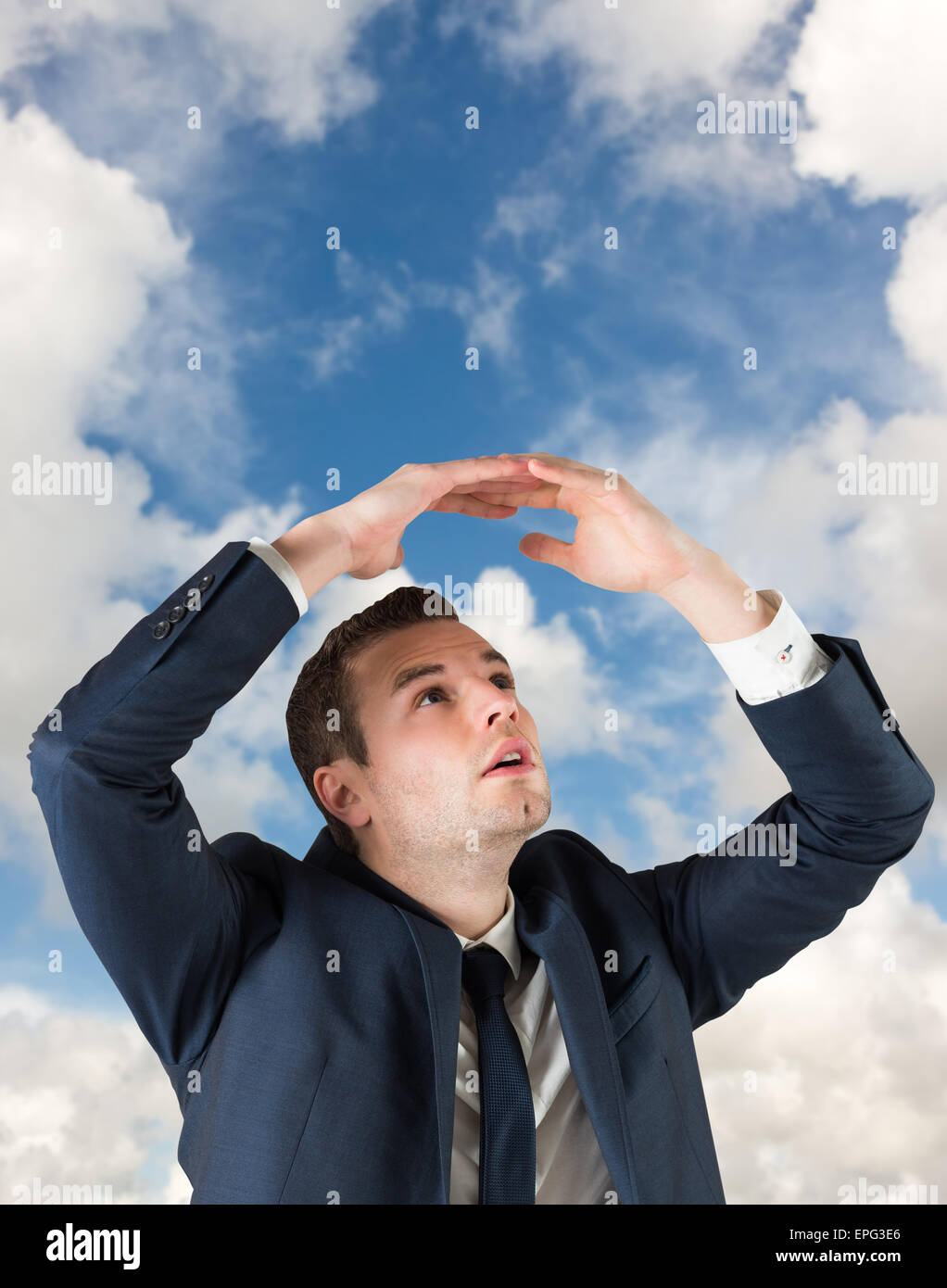 Composite image of businessman standing with hands over head Stock ...